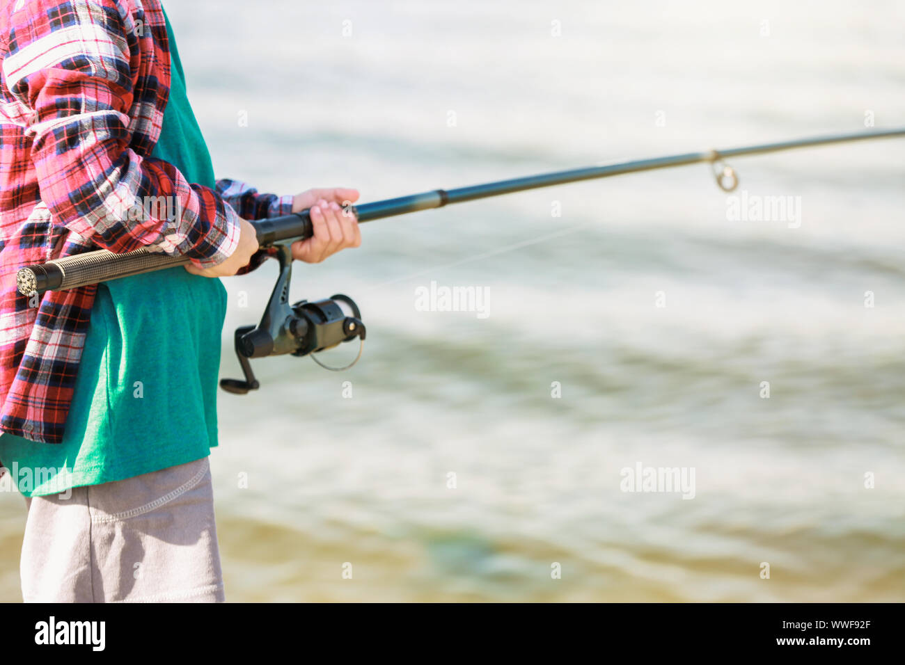 Cute little boy fishing on river Stock Photo - Alamy