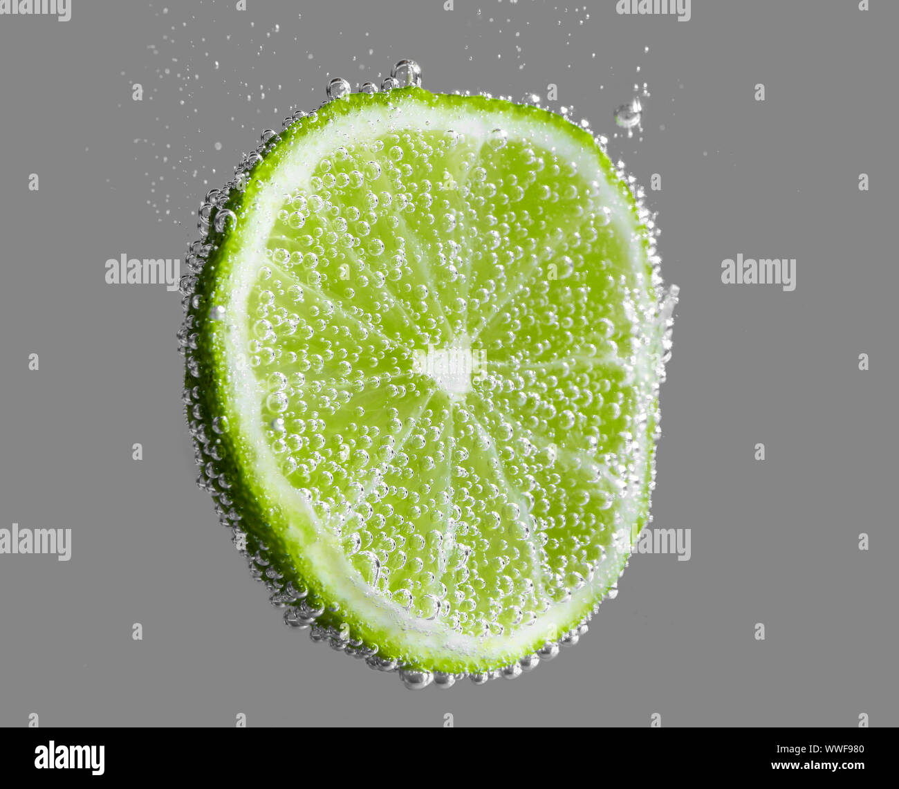 Ripe lime slice in water Stock Photo - Alamy