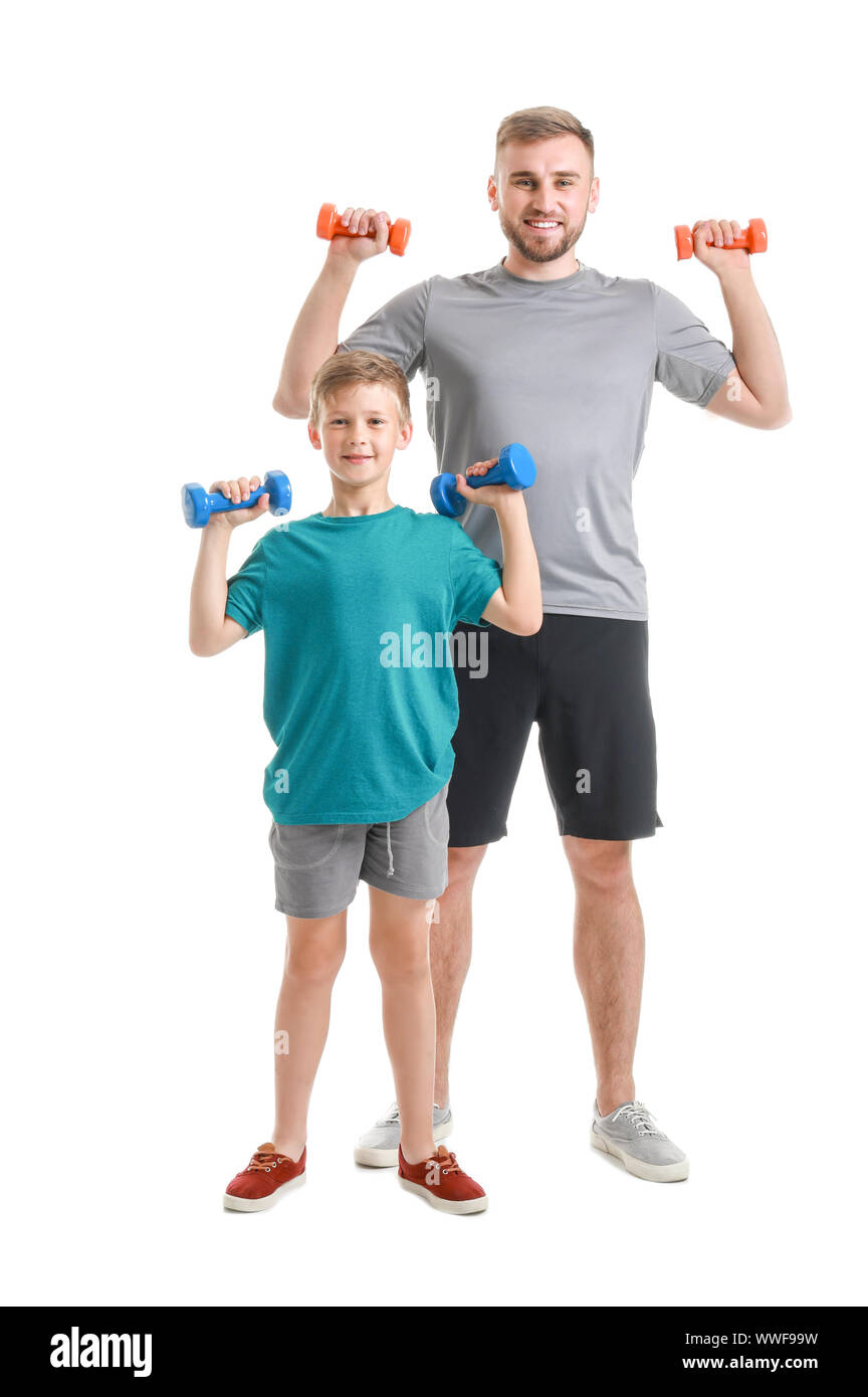 Portrait of father and son training with dumbbells on white background ...