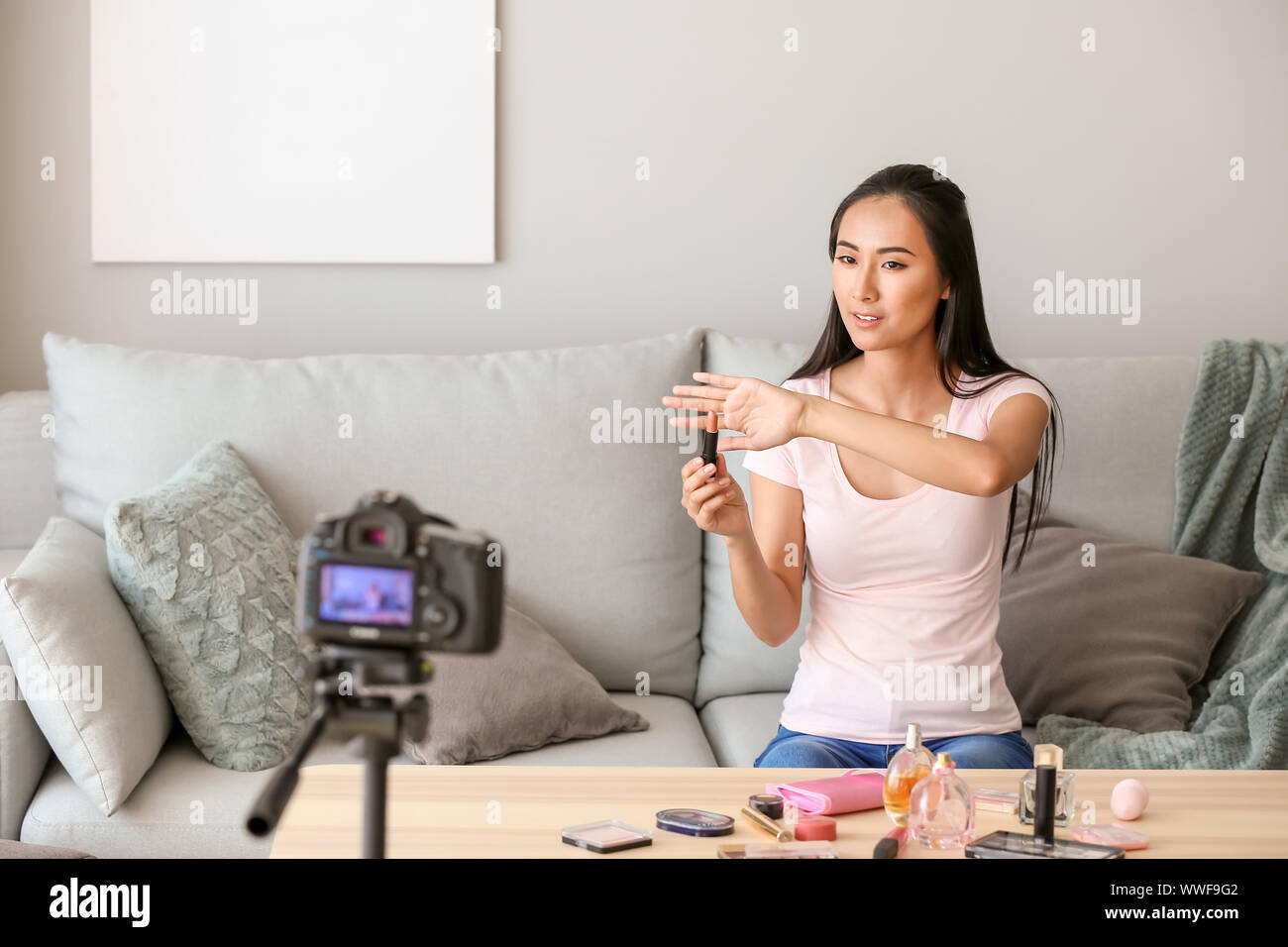 Asian beauty blogger recording video at home Stock Photo - Alamy