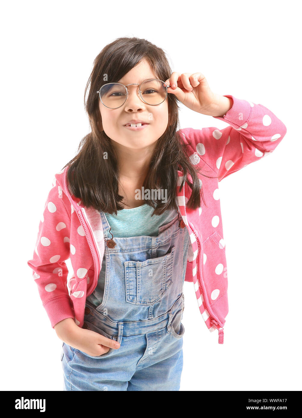 Portrait of cute little girl wearing eyeglasses on white background ...