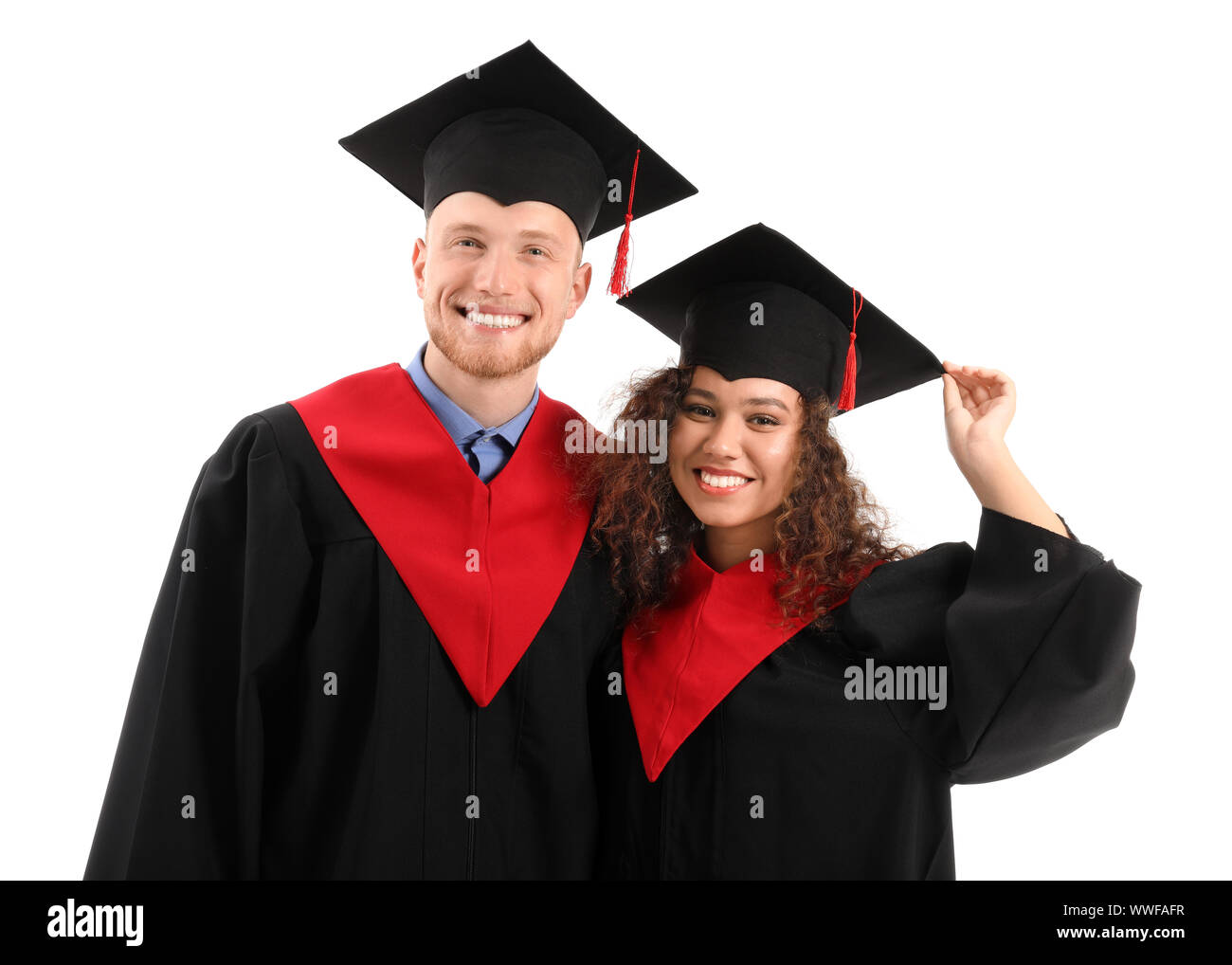 Young students in bachelor robes on white background Stock Photo - Alamy