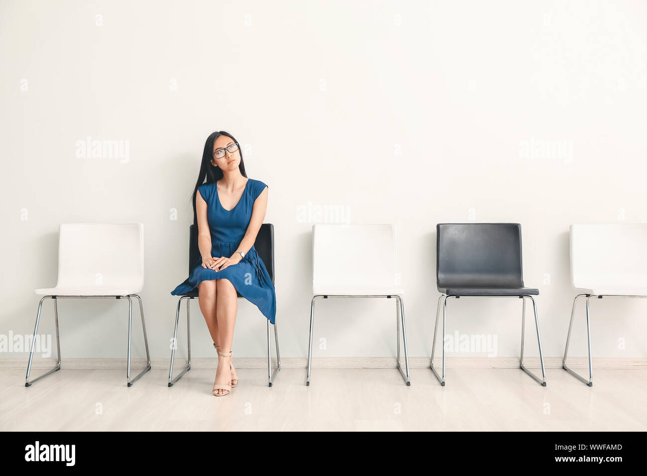 Asian woman waiting for job interview indoors Stock Photo - Alamy