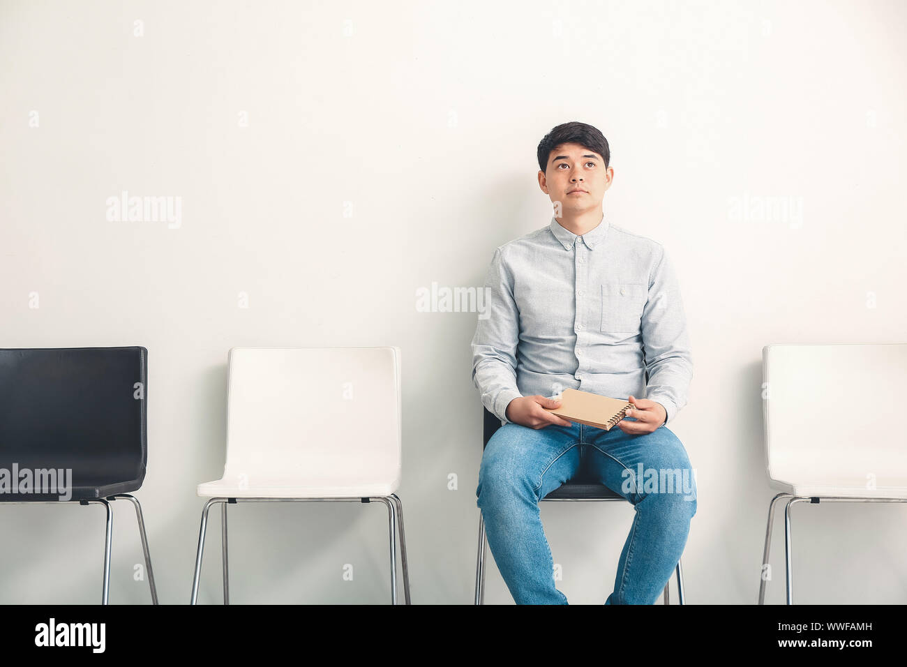 Asian man waiting for job interview indoors Stock Photo - Alamy