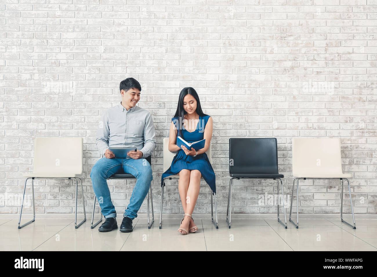 Young people waiting for job interview indoors Stock Photo - Alamy
