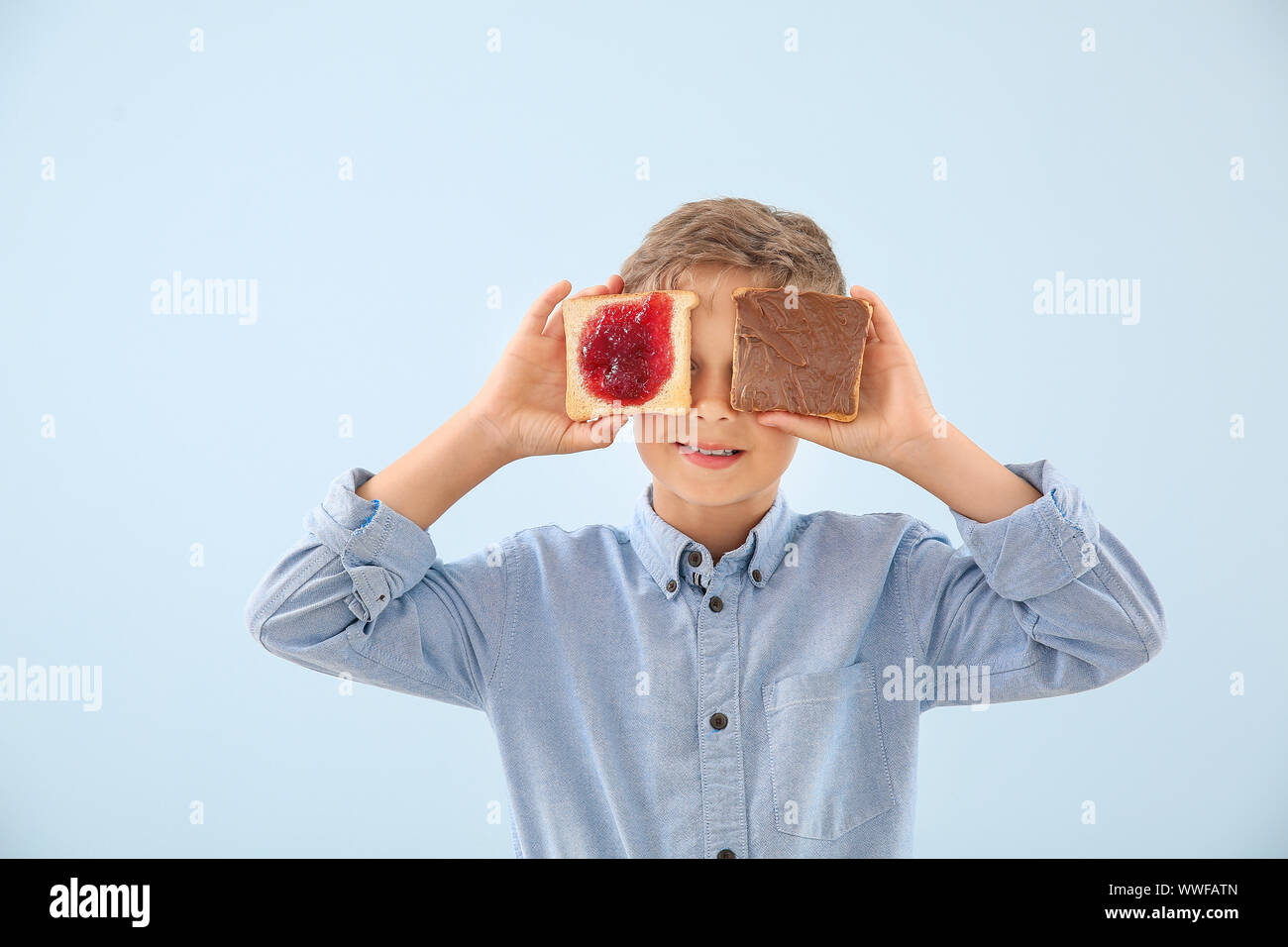 Boy eating jam on toast hi-res stock photography and images - Alamy