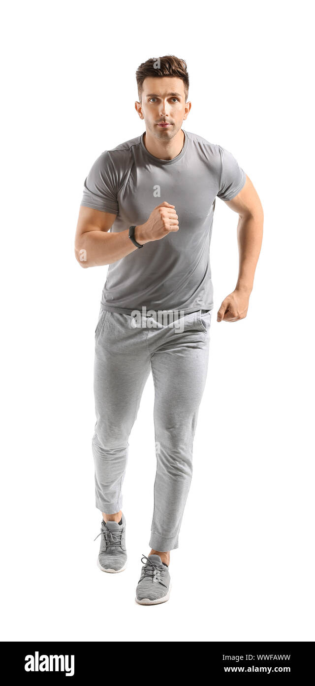 Running young man on white background Stock Photo - Alamy