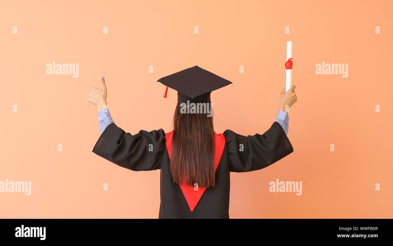 Female graduate with diploma on color background Stock Photo - Alamy