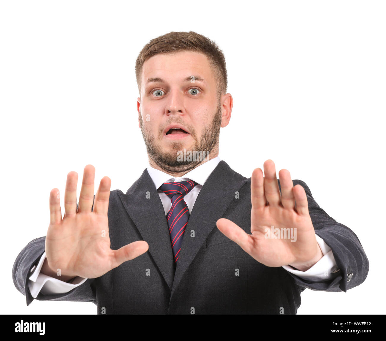 Businessman having panic attack on white background Stock Photo - Alamy
