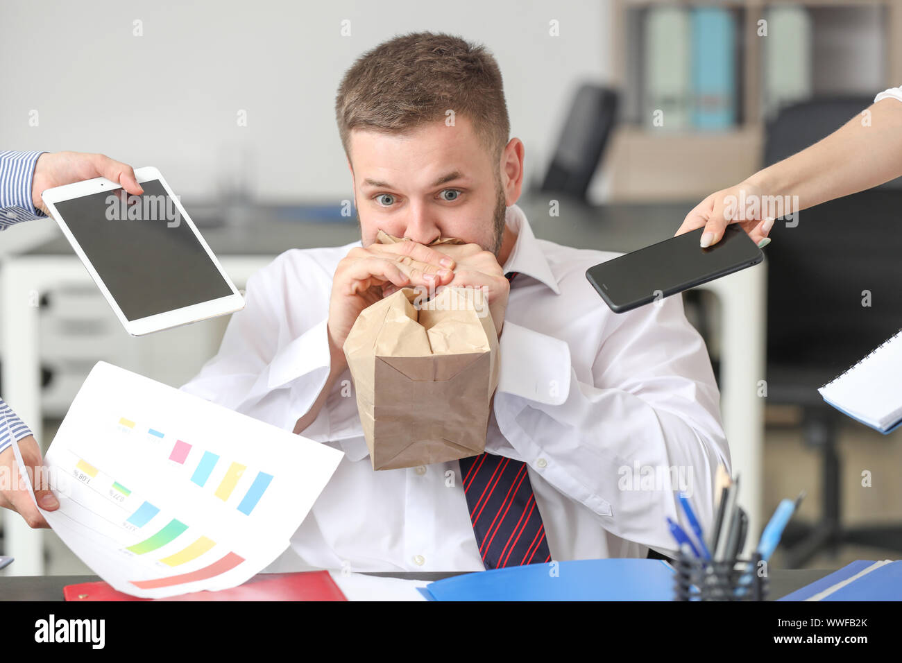 Overworked businessman having panic attack in office Stock Photo - Alamy