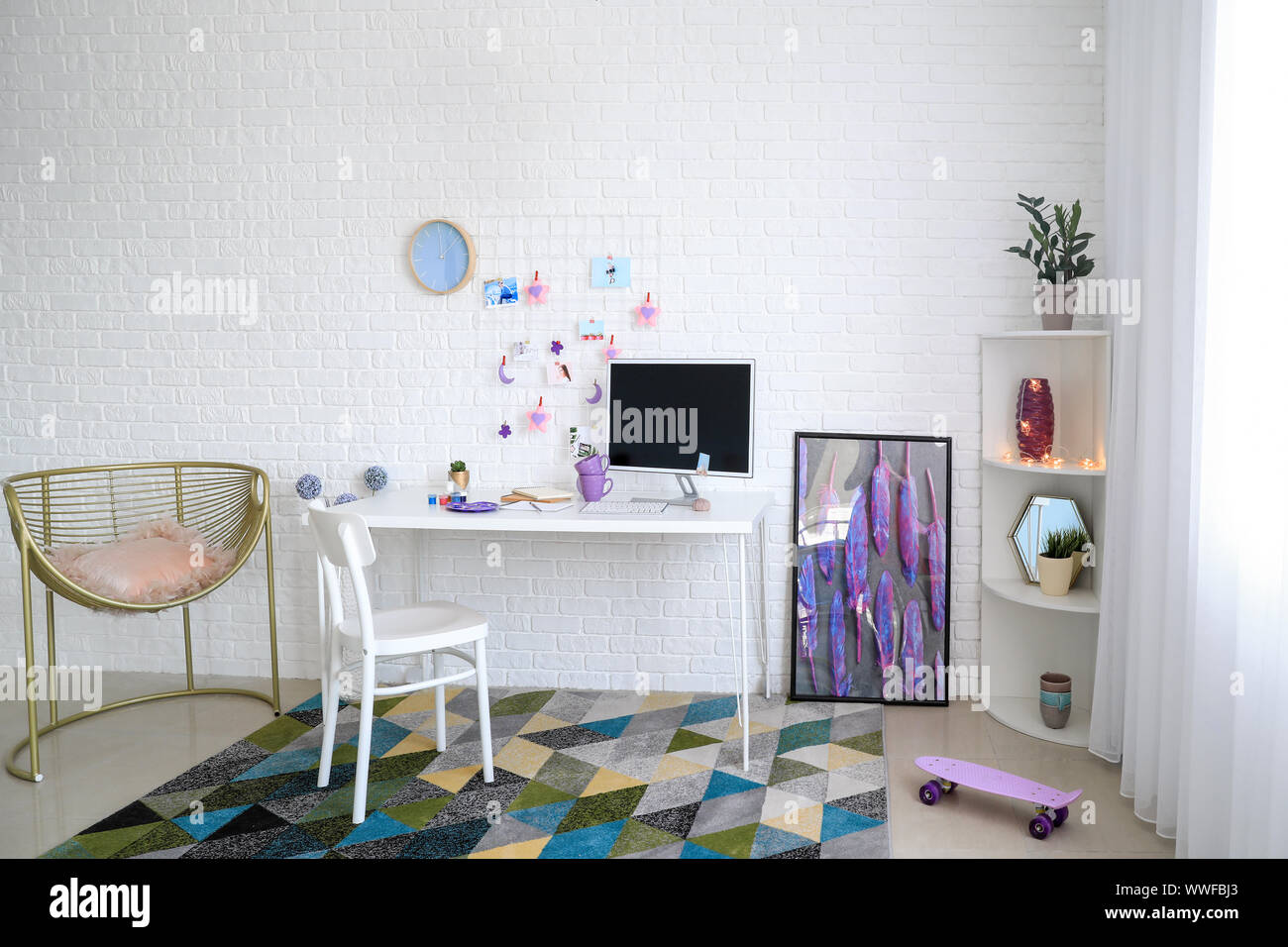 Workplace with mood board and computer in modern room Stock Photo - Alamy