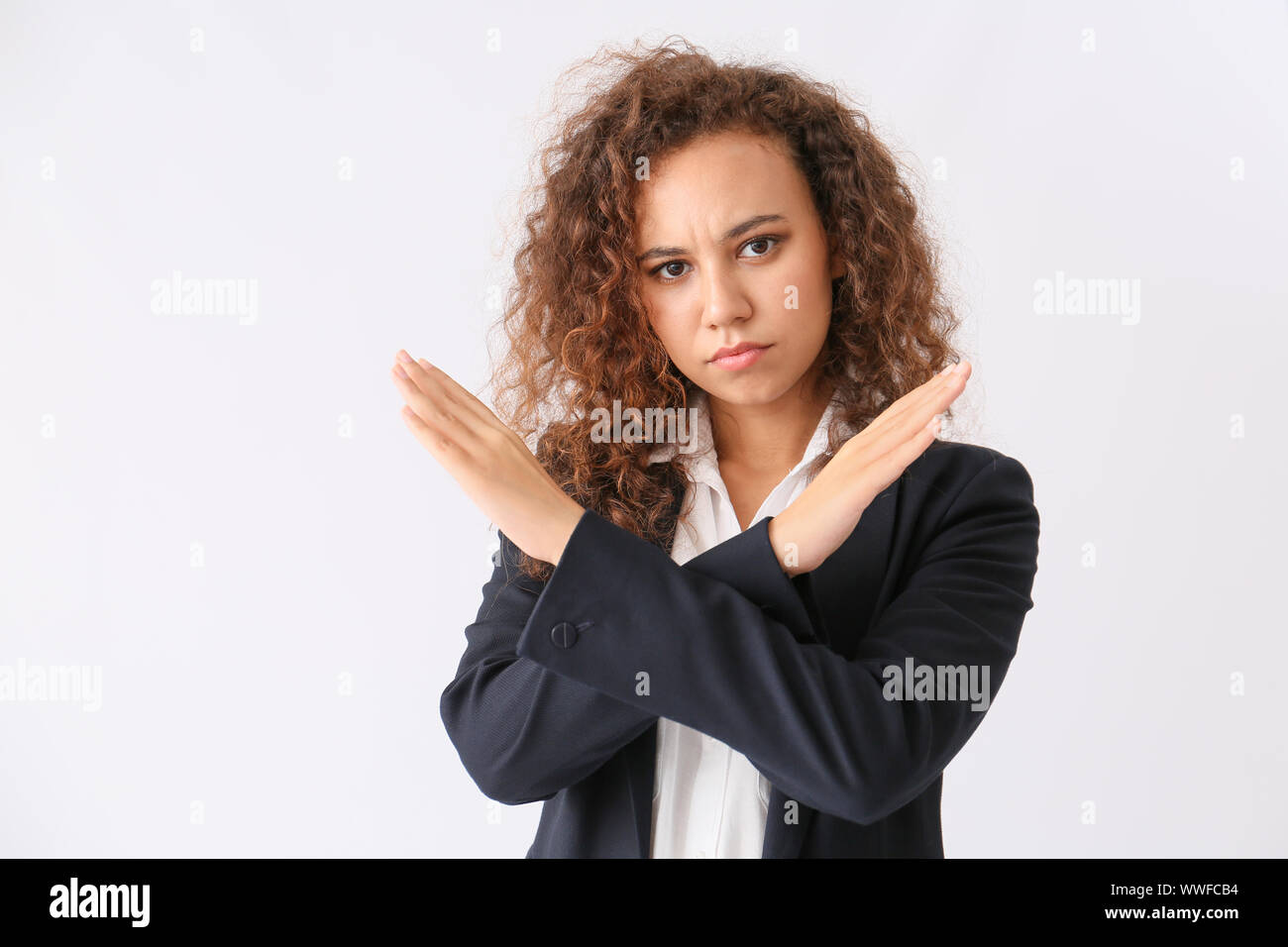 African-American businesswoman rejecting something on white background ...