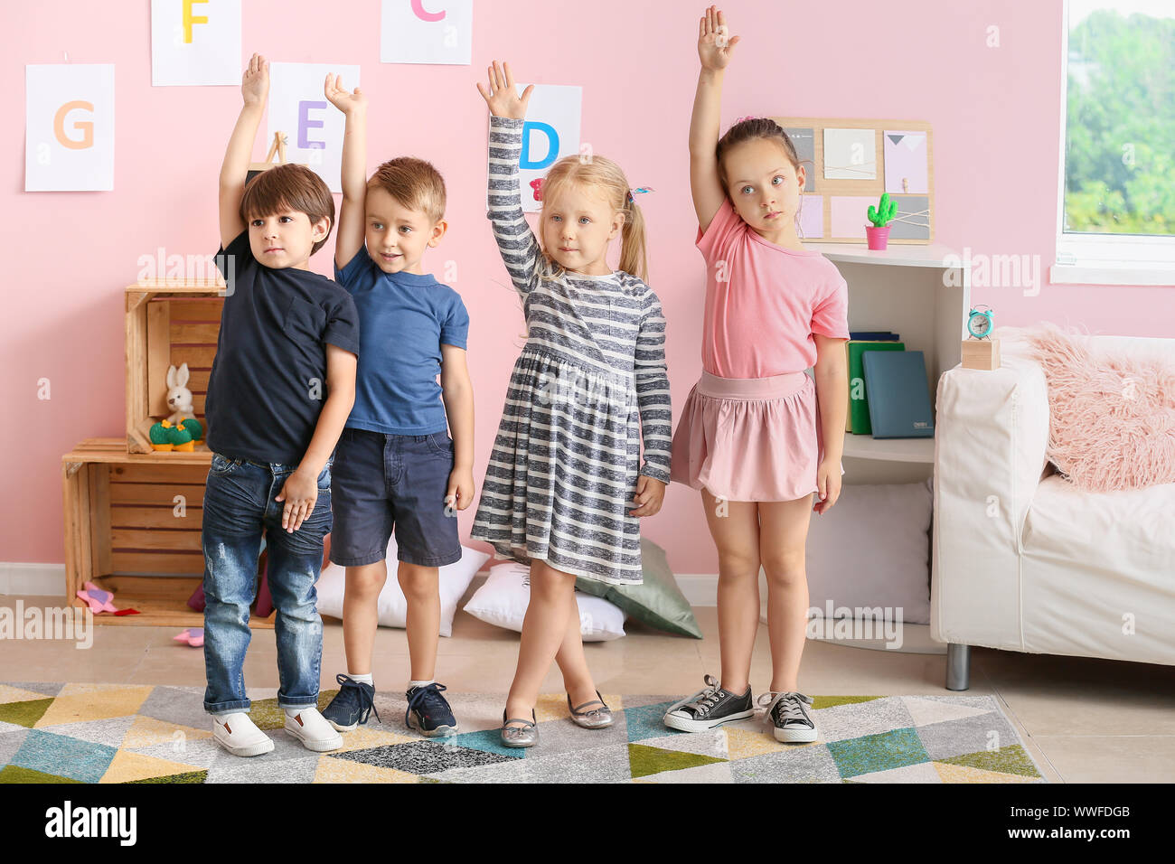 Cute little children in kindergarten Stock Photo - Alamy