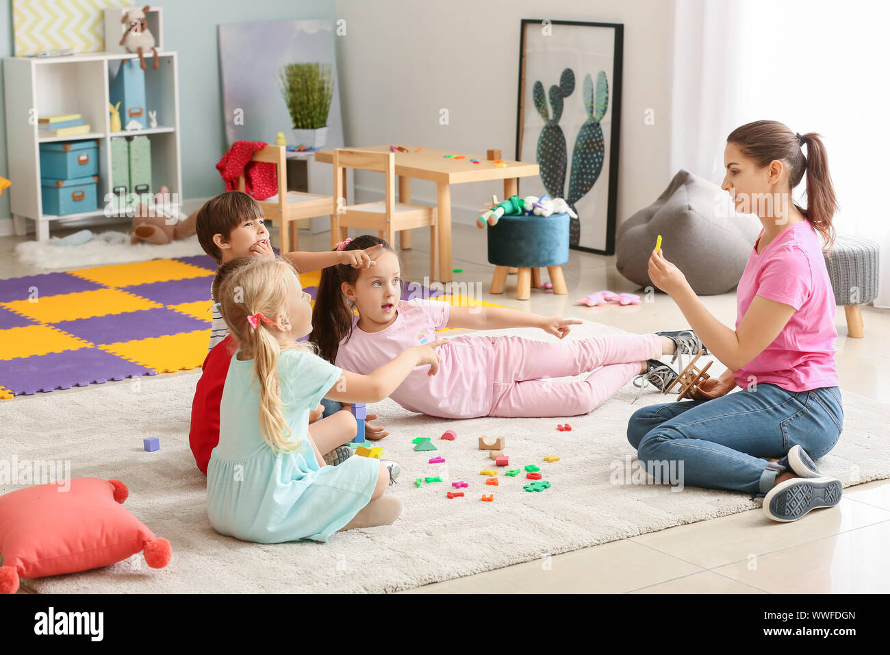 Cute little children learning letters in kindergarten Stock Photo - Alamy