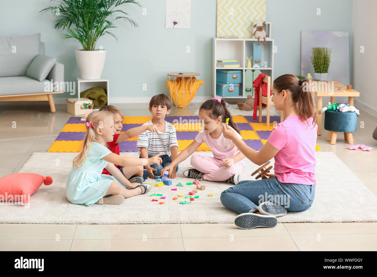 Cute little children learning letters in kindergarten Stock Photo - Alamy