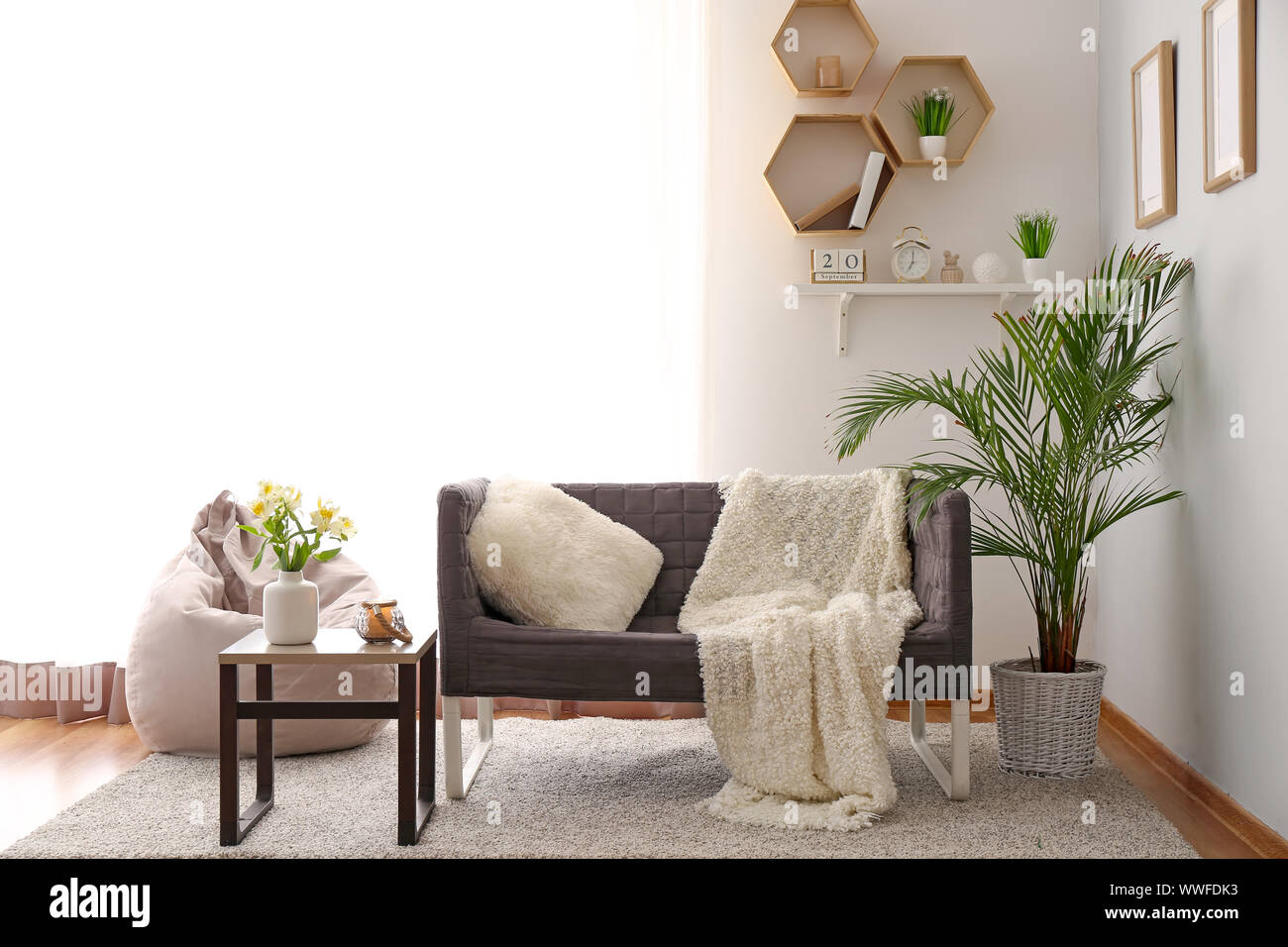 Interior of beautiful light living room Stock Photo - Alamy