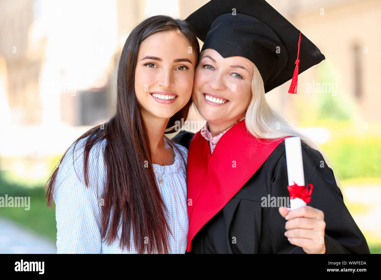 Daughter with mother on her graduation day Stock Photo - Alamy