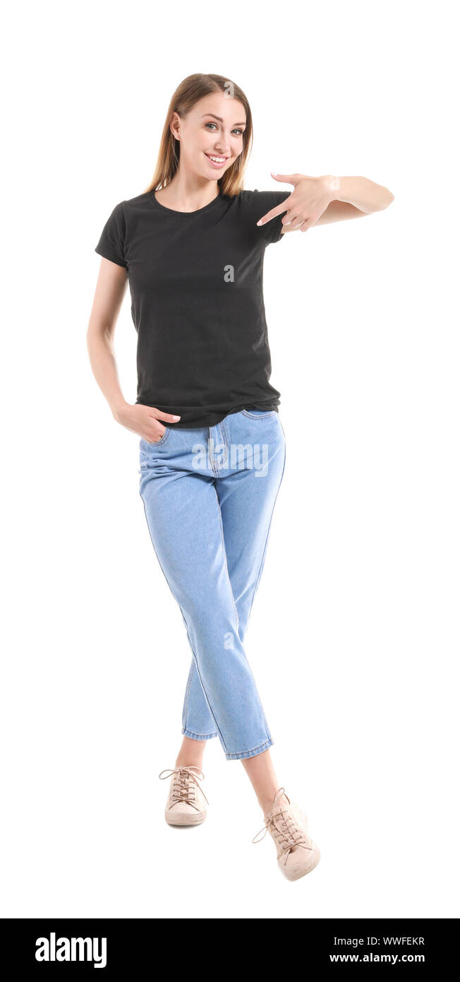 Woman pointing at her t-shirt against white background Stock Photo - Alamy
