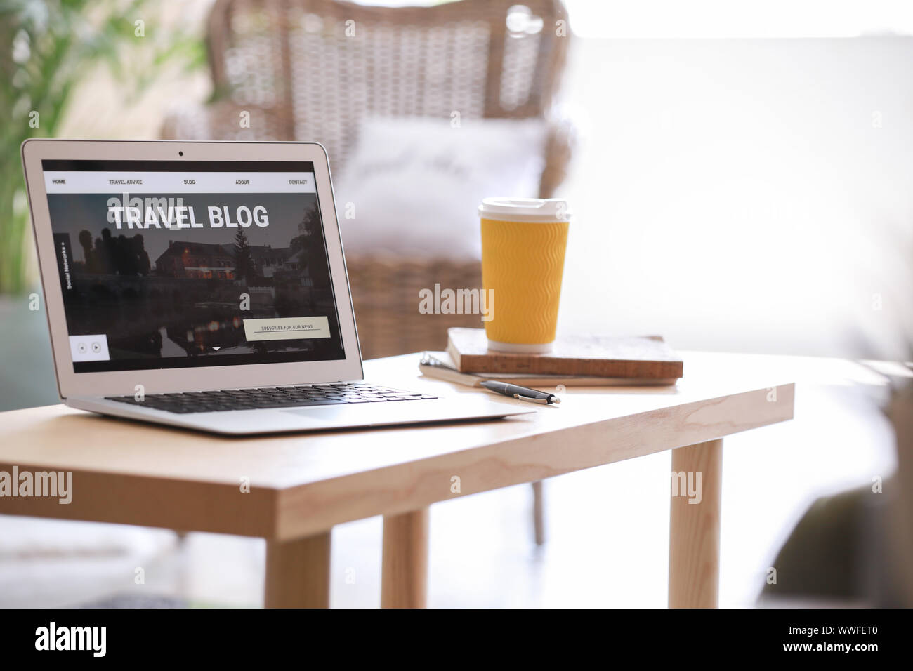 Laptop with open page of travel blog on table Stock Photo - Alamy
