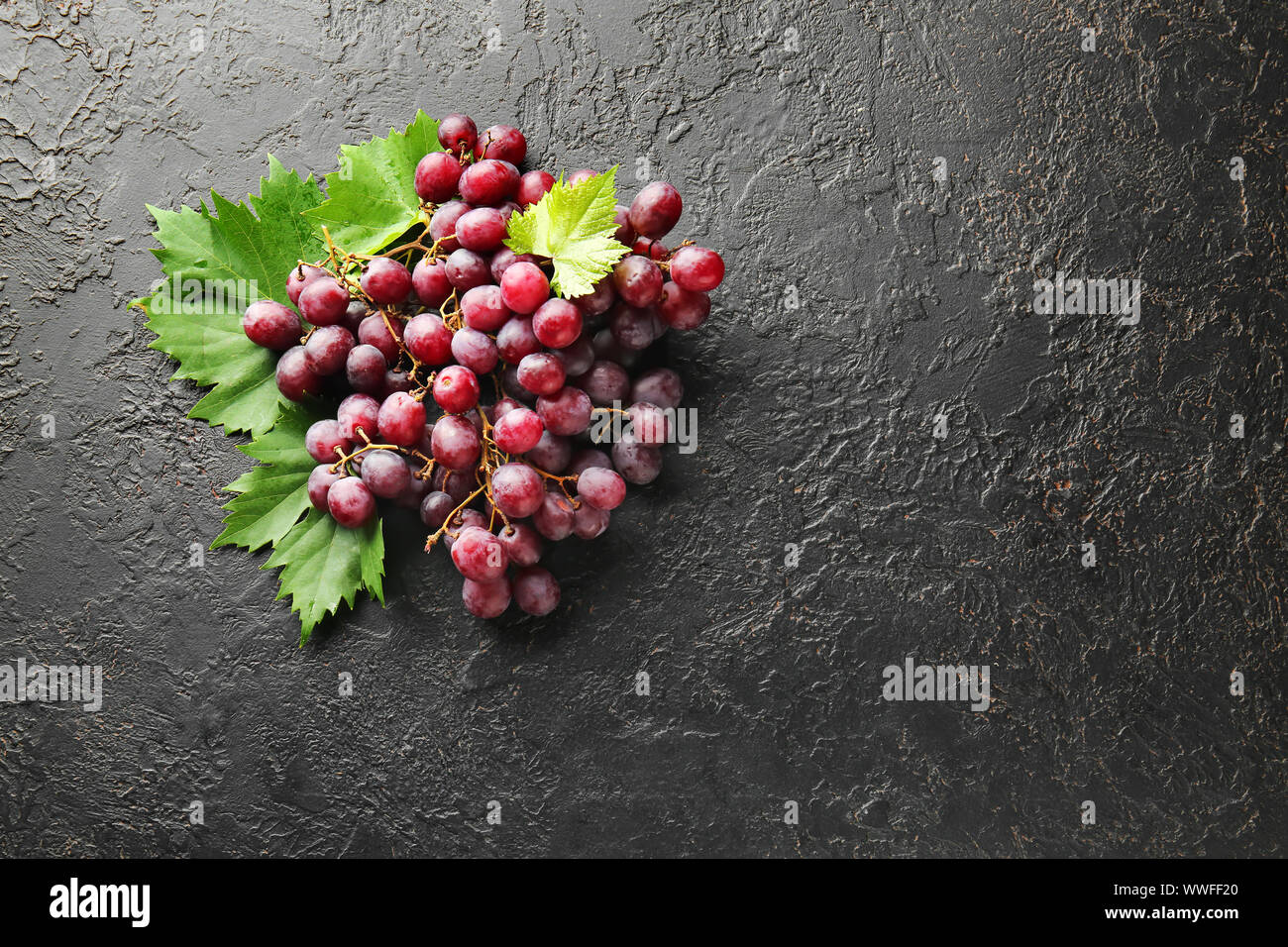 Ripe sweet grapes on dark background Stock Photo - Alamy