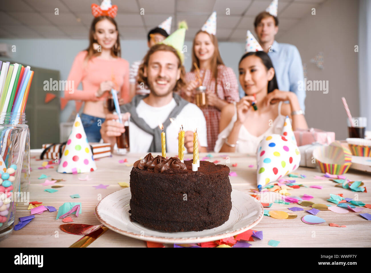 Tasty Birthday cake and group of friends at party Stock Photo - Alamy