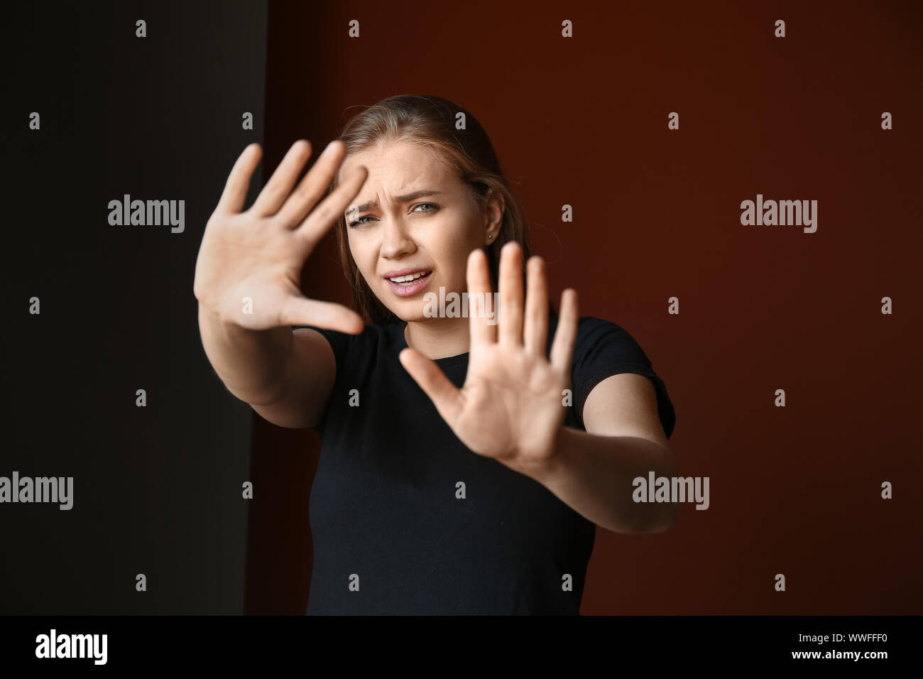 Woman having panic attack on dark background Stock Photo - Alamy