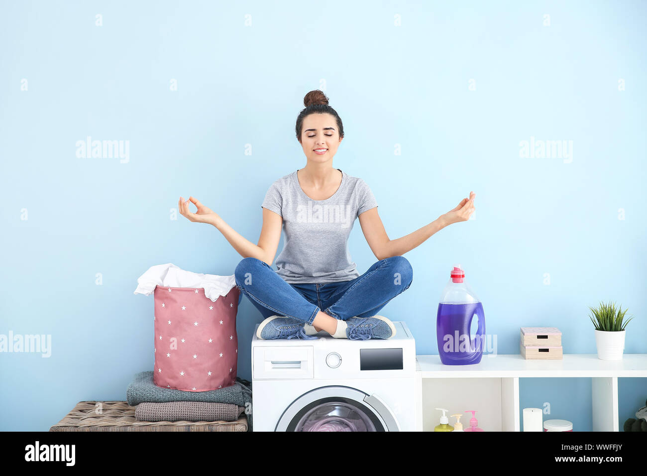 Girl sitting on washing machine hi-res stock photography and images - Alamy