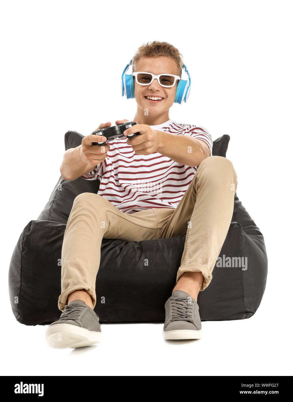 Teenage boy playing video game on white background Stock Photo - Alamy
