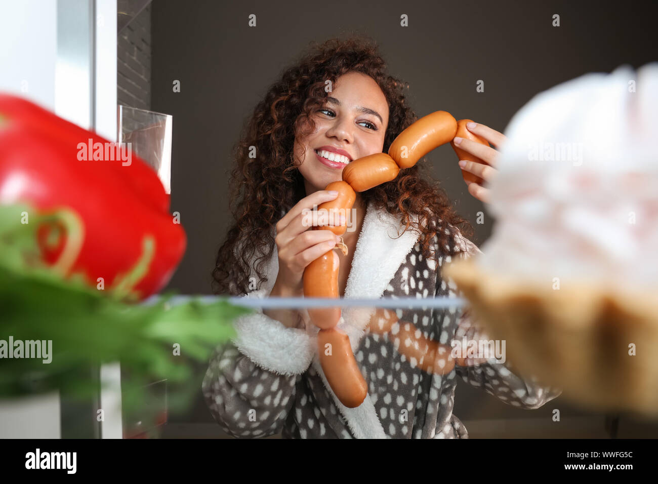 Young woman choosing food in fridge, view from inside Stock Photo - Alamy