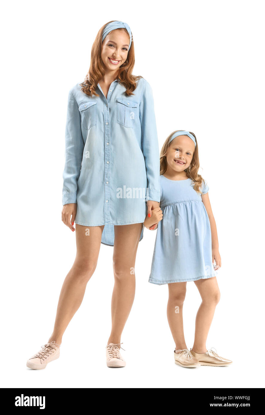 Portrait of beautiful woman with her little daughter on white ...