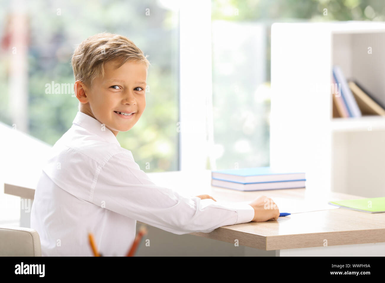 Pupil passing school test in classroom Stock Photo - Alamy