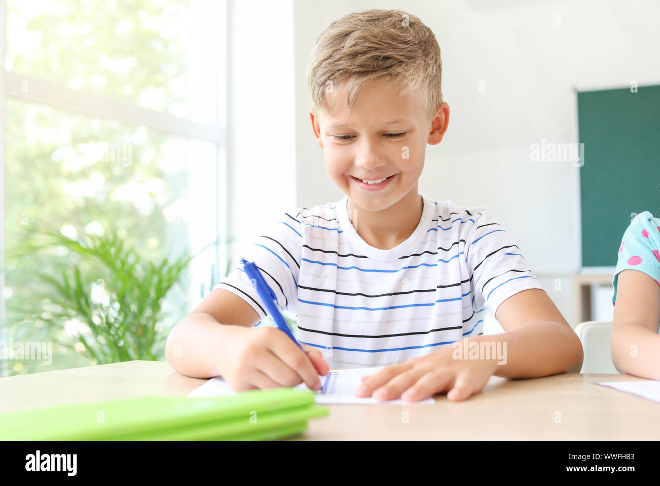 Pupils passing school test in classroom Stock Photo - Alamy