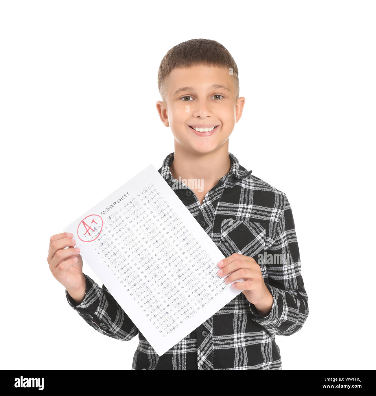 Happy boy with answer sheet for school test on white background Stock ...
