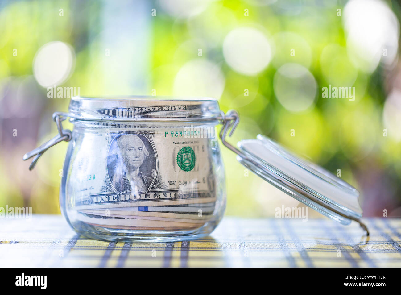 American banknote in glass jar Stock Photo - Alamy