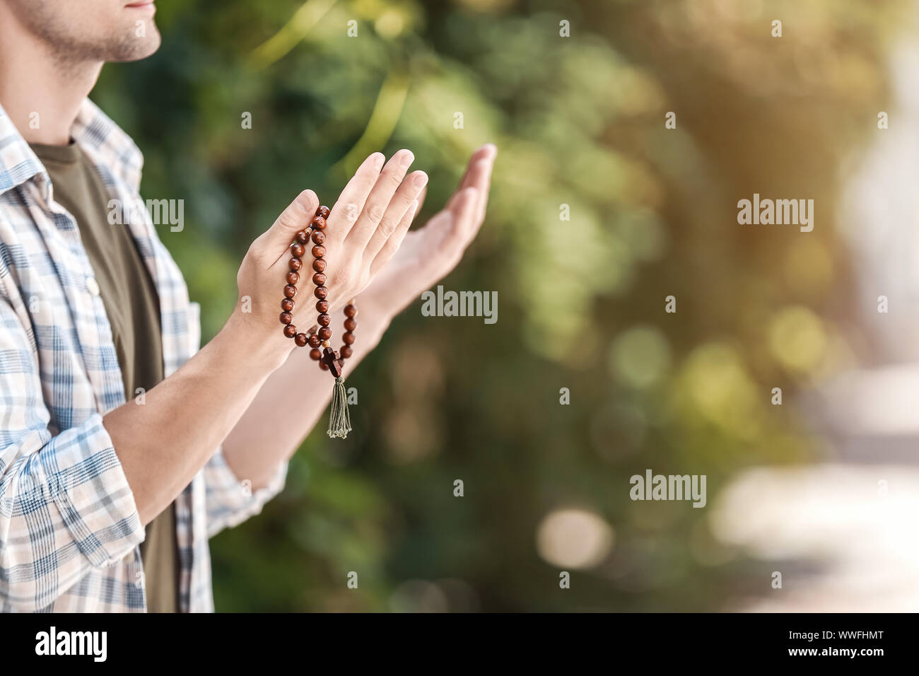 Religious man praying to God outdoors Stock Photo - Alamy