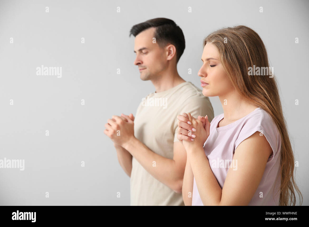 Christian couple praying together hi-res stock photography and images ...