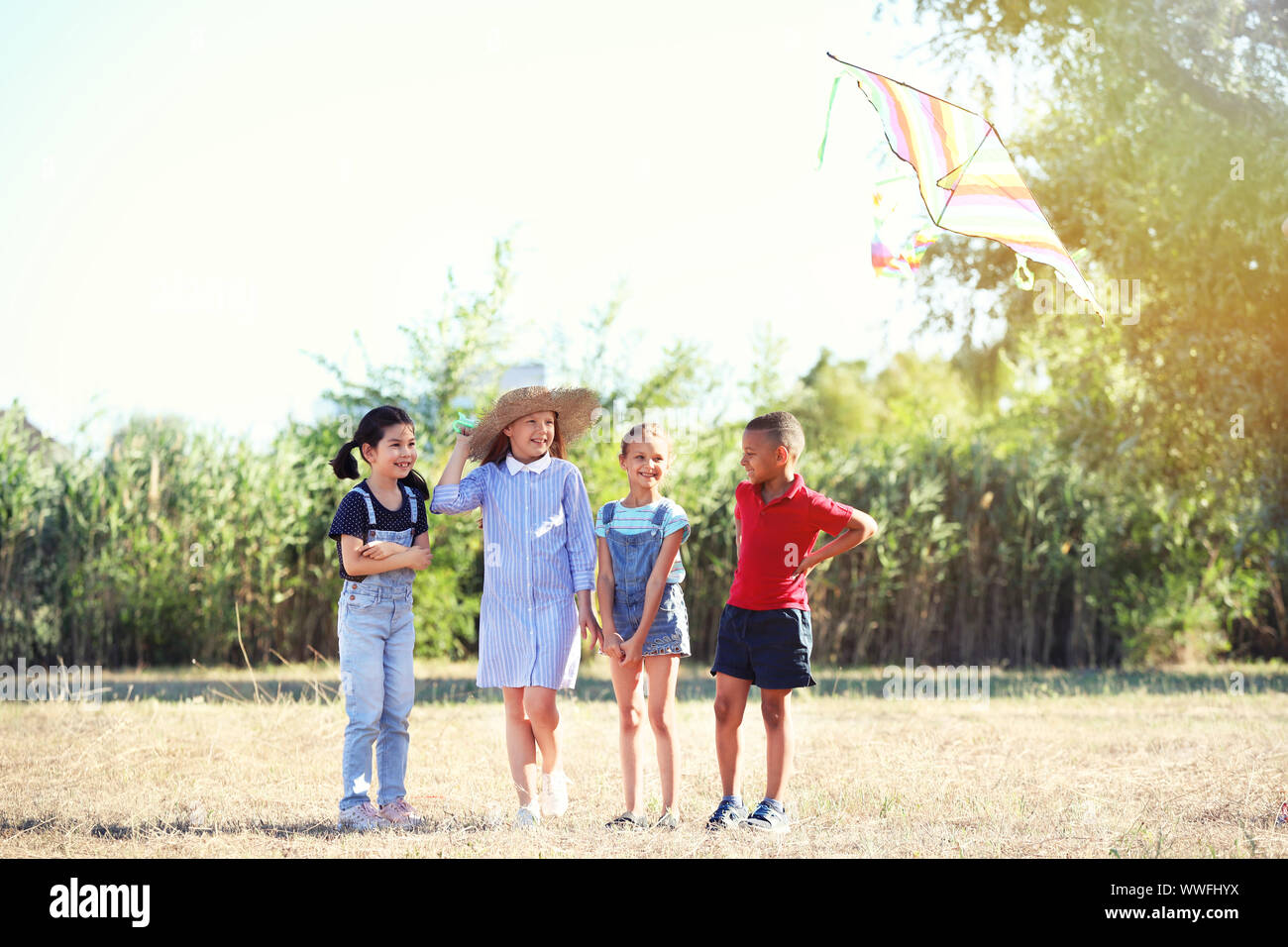 Little children flying kite outdoors Stock Photo - Alamy