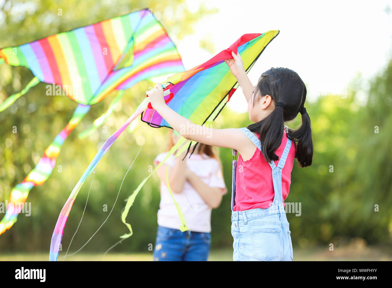 Little children flying kite outdoors Stock Photo - Alamy