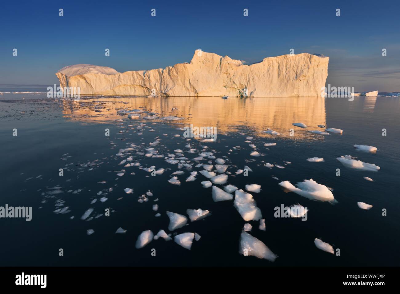 Iceberg at sunset. Nature and landscapes of Greenland. Disko bay. West ...