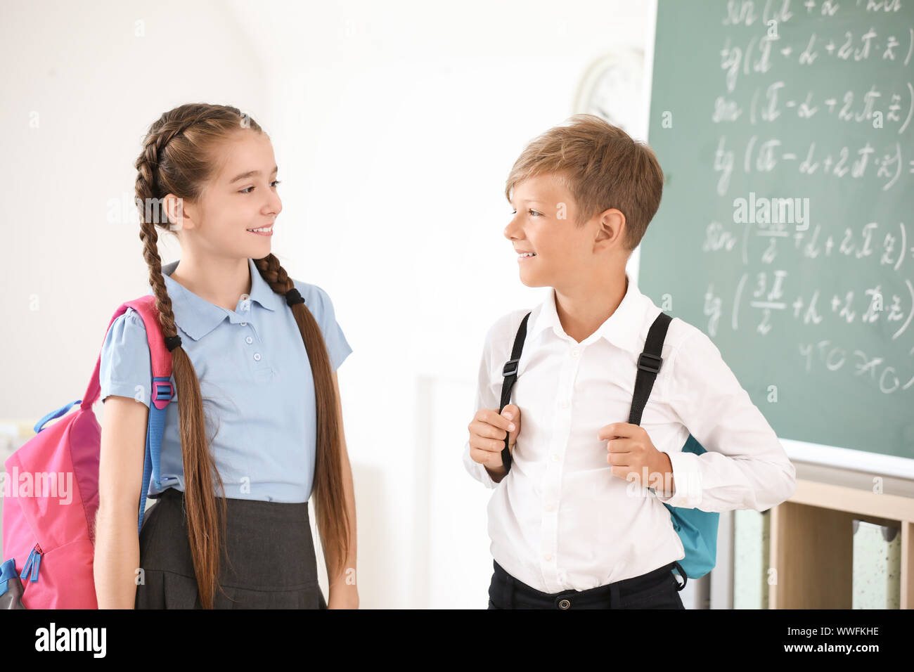 Cute little pupils in classroom Stock Photo - Alamy