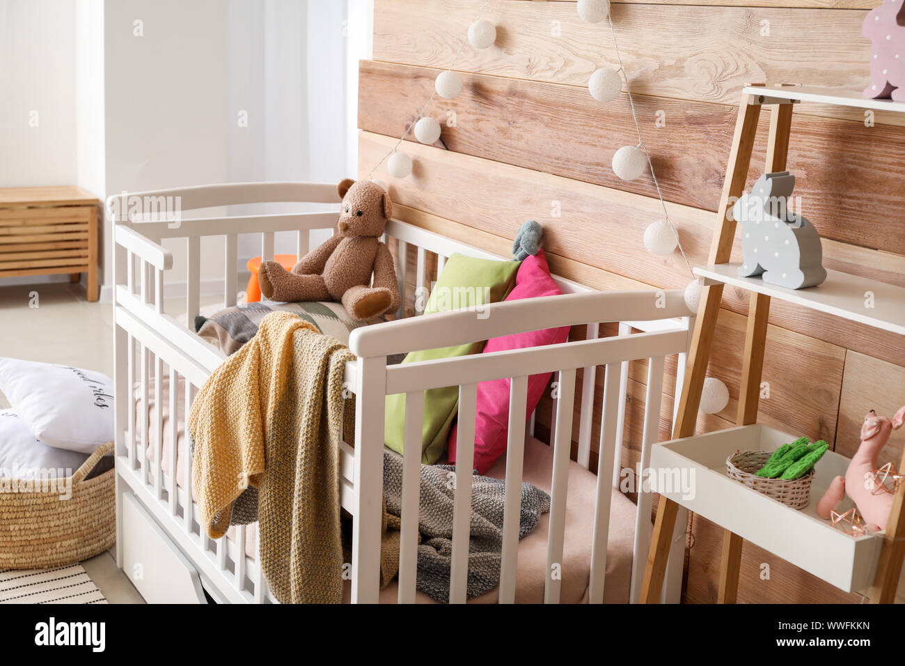 Interior of modern baby room with crib Stock Photo - Alamy