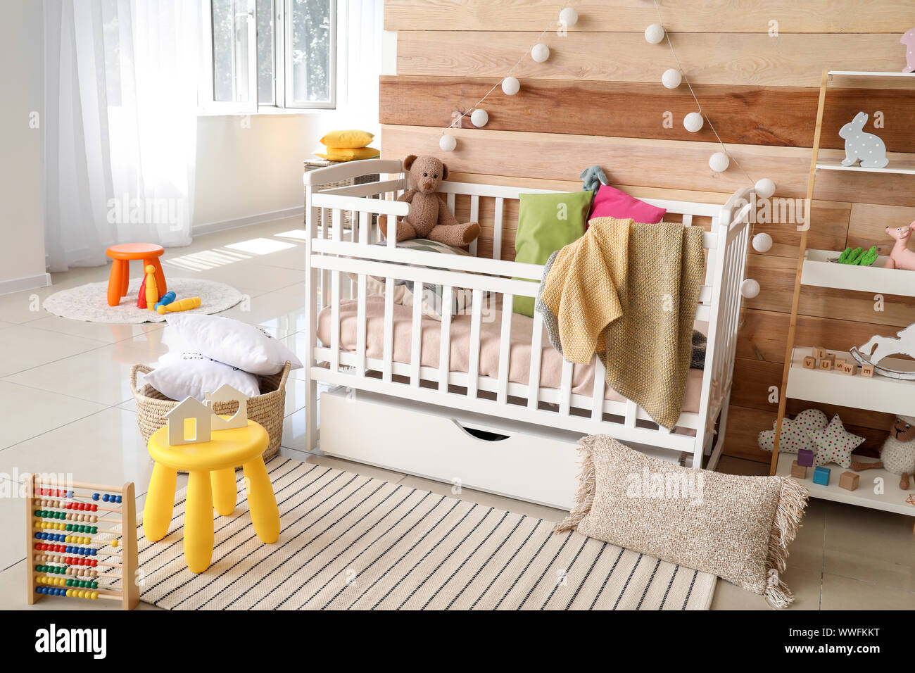 Interior of modern baby room with crib Stock Photo - Alamy