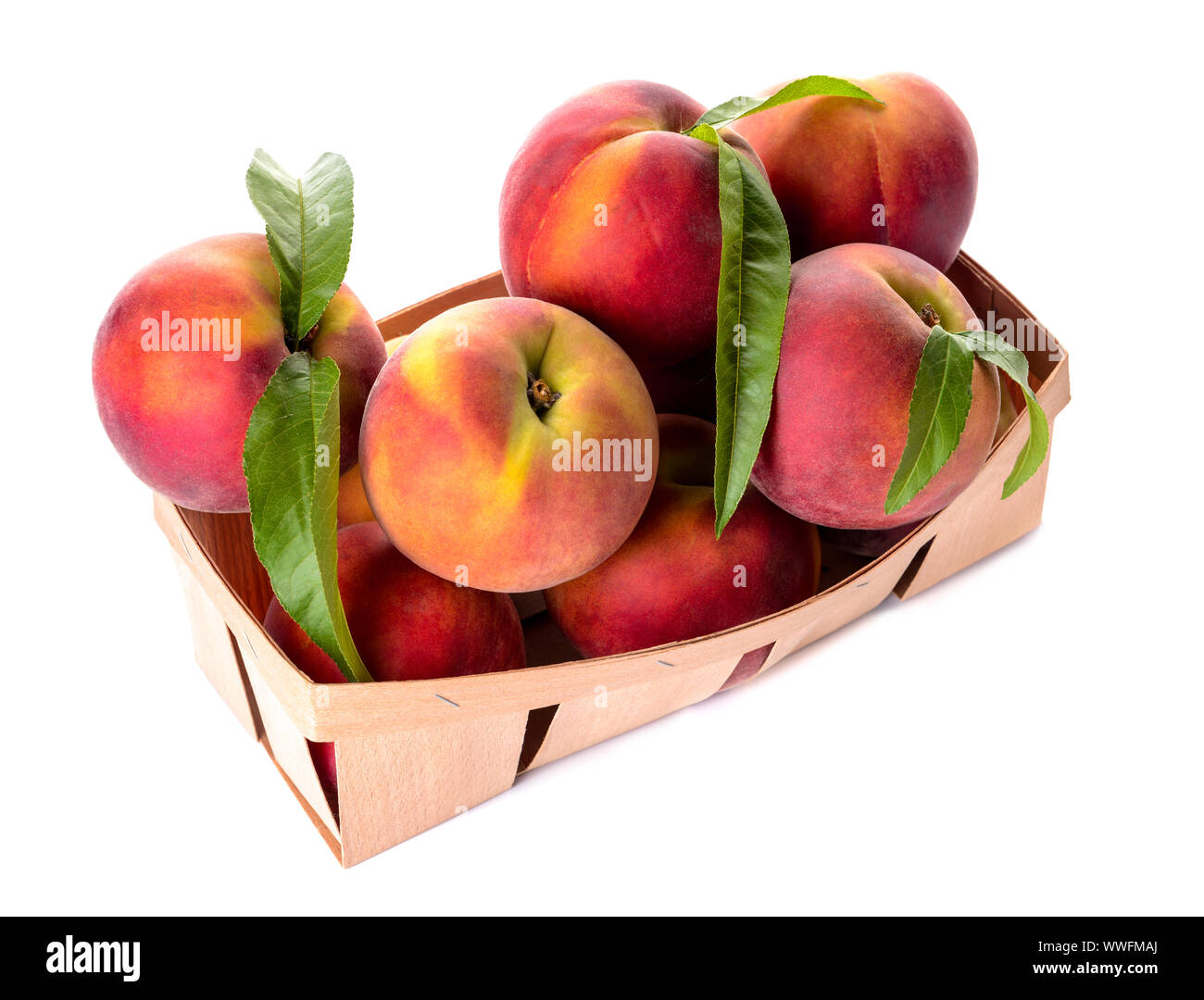 Box with ripe peaches on white background Stock Photo - Alamy