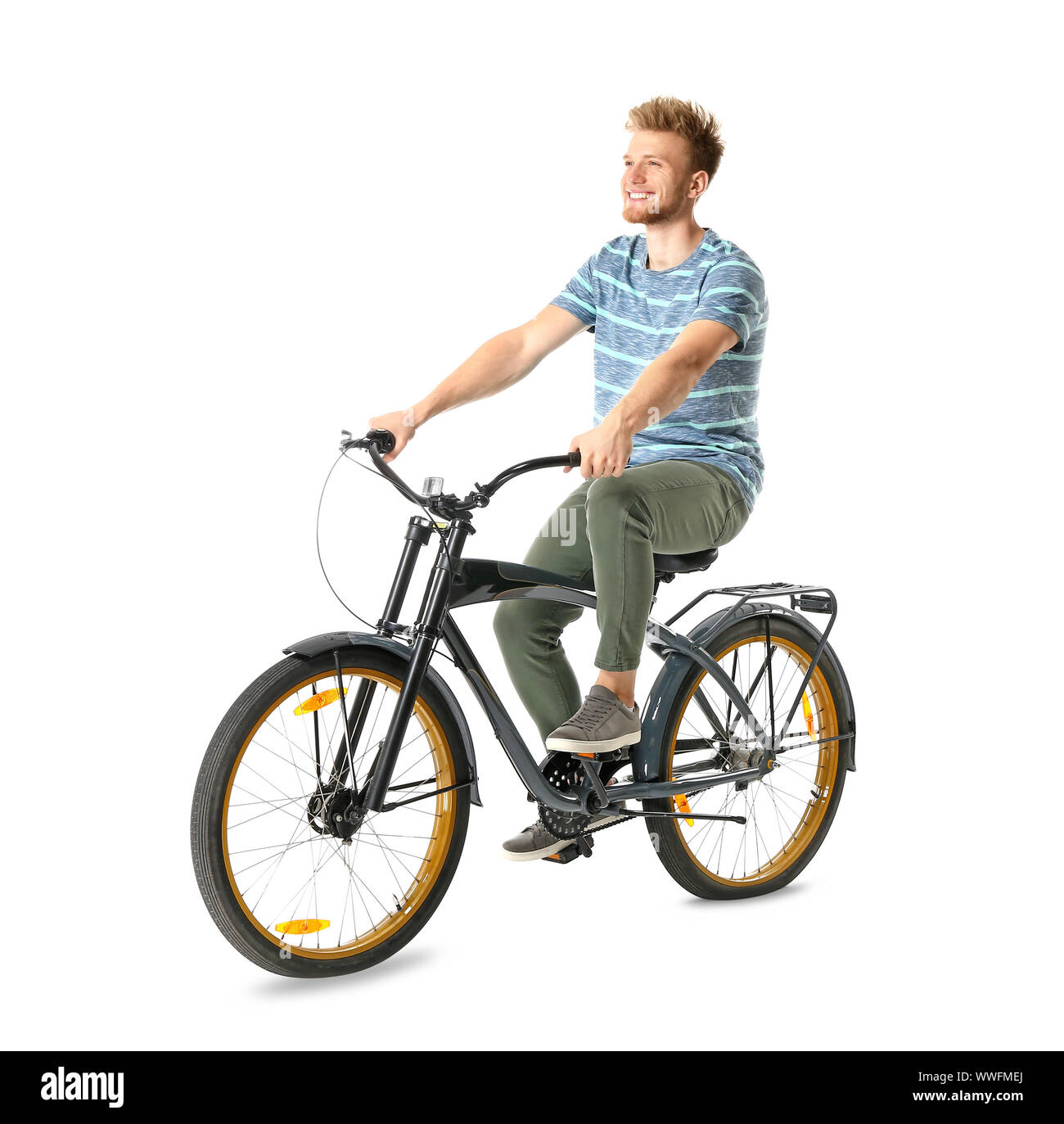 Young man riding bicycle against white background Stock Photo - Alamy