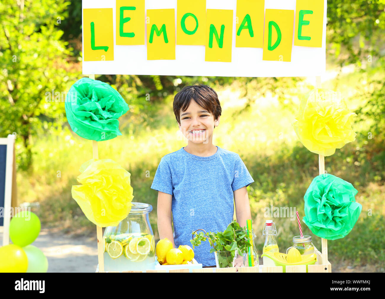 Cute little boy at lemonade stand in park Stock Photo - Alamy