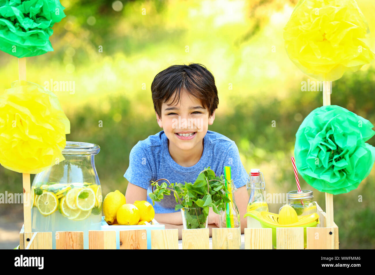 Cute little boy at lemonade stand in park Stock Photo - Alamy