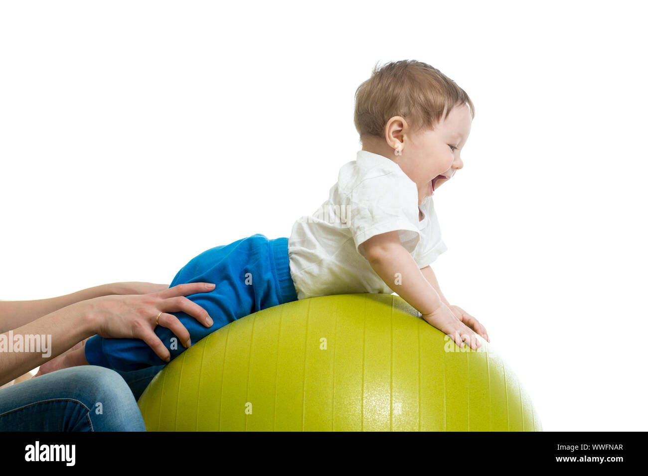 Mother does exercises with baby. Cute child playing with fitness ball ...