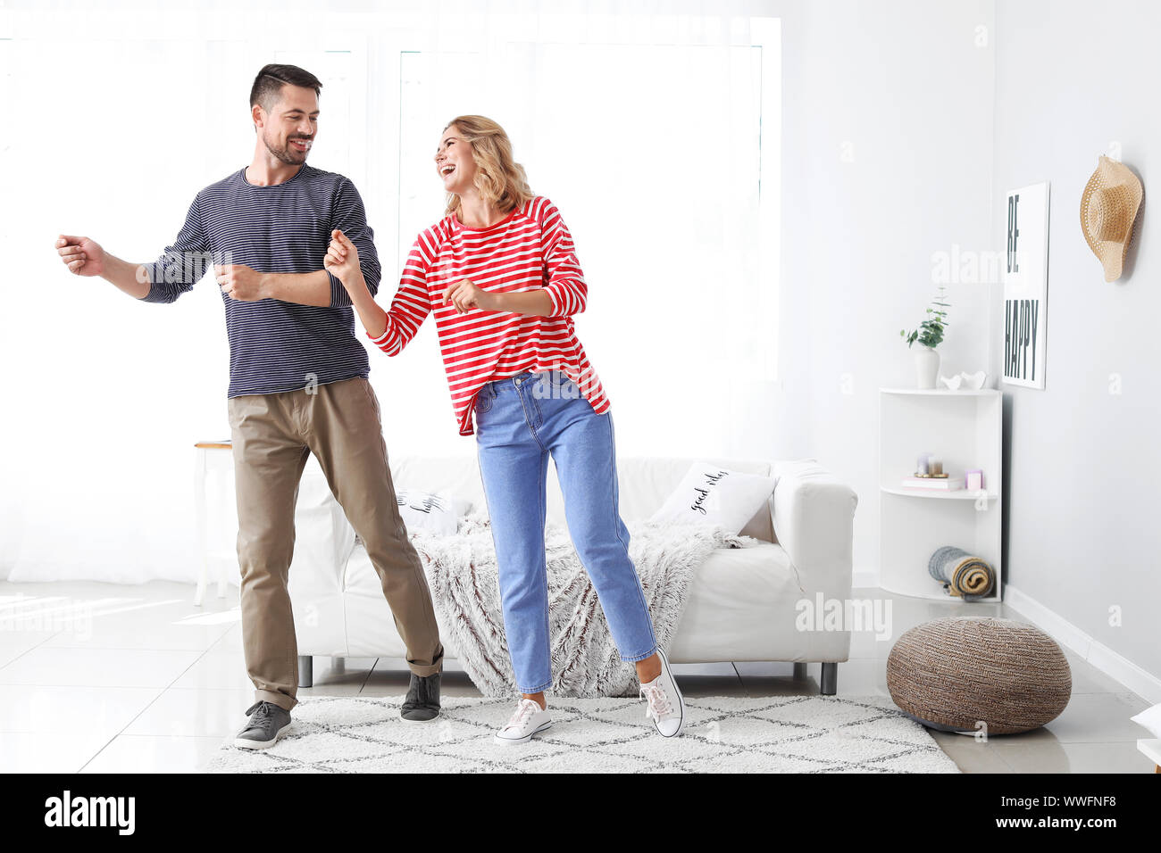 Happy dancing couple at home Stock Photo - Alamy