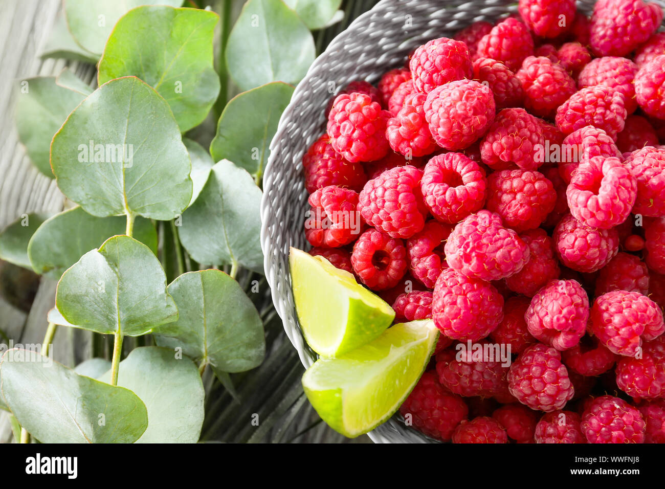 Raspberries in wicker bowl hi-res stock photography and images - Alamy