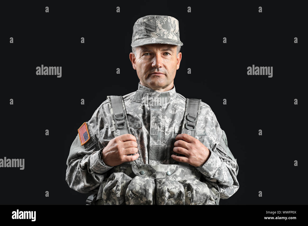 Mature male soldier on dark background Stock Photo - Alamy